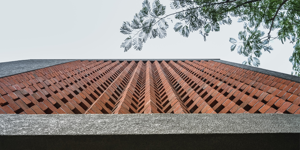HundredDesigns render Skewed Brick Home in Surat playful materials