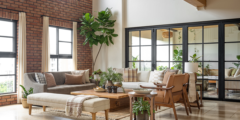 Amoeba Design reminisces arches and barn doors in a Pune home